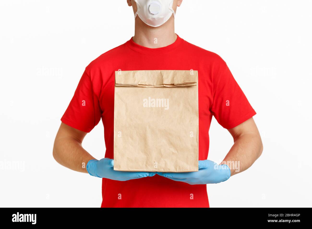 Protection of parcel. Courier carefully holds package Stock Photo - Alamy