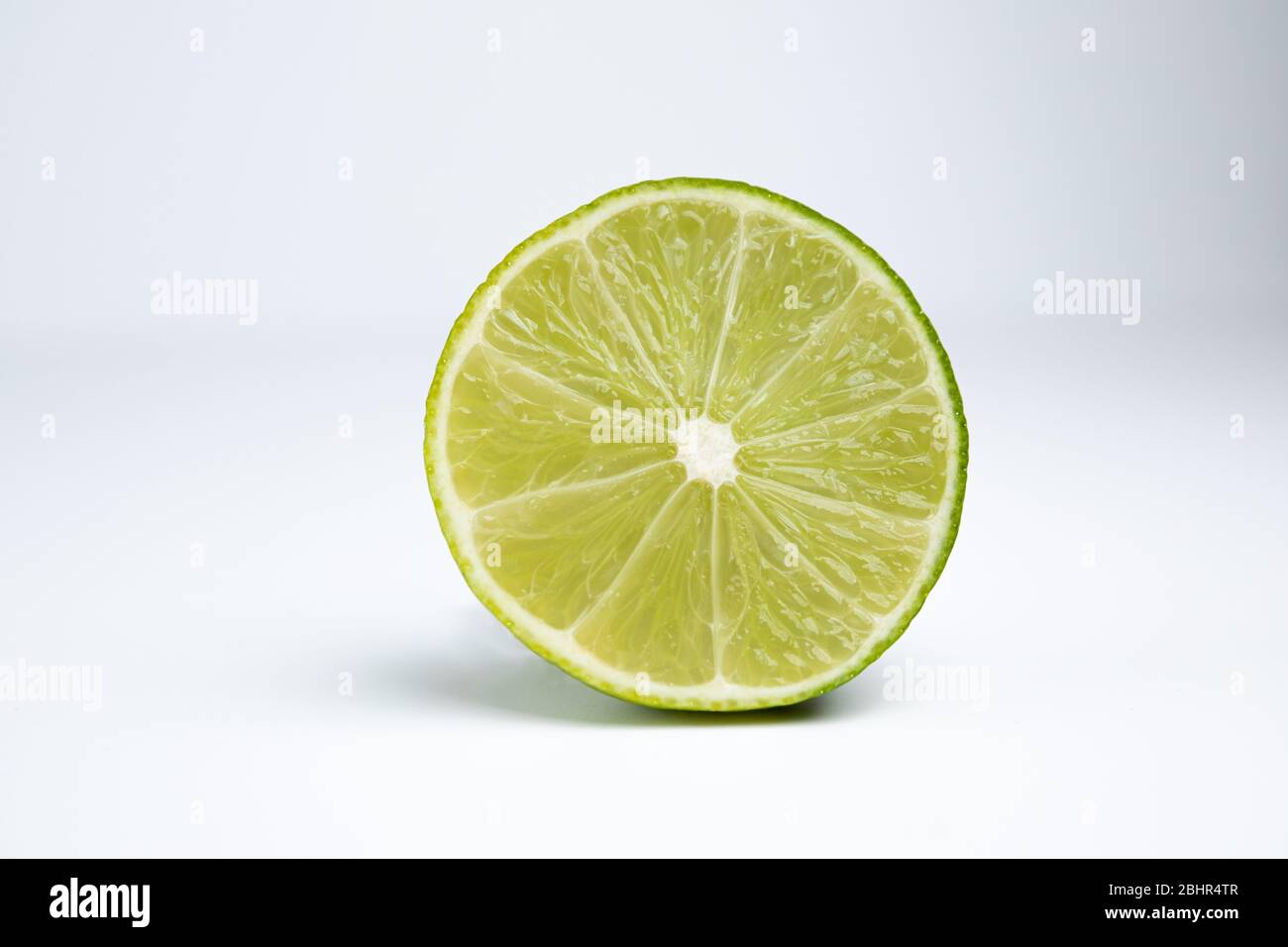 Cross-section of lime fruit isolated on a white background Stock Photo ...