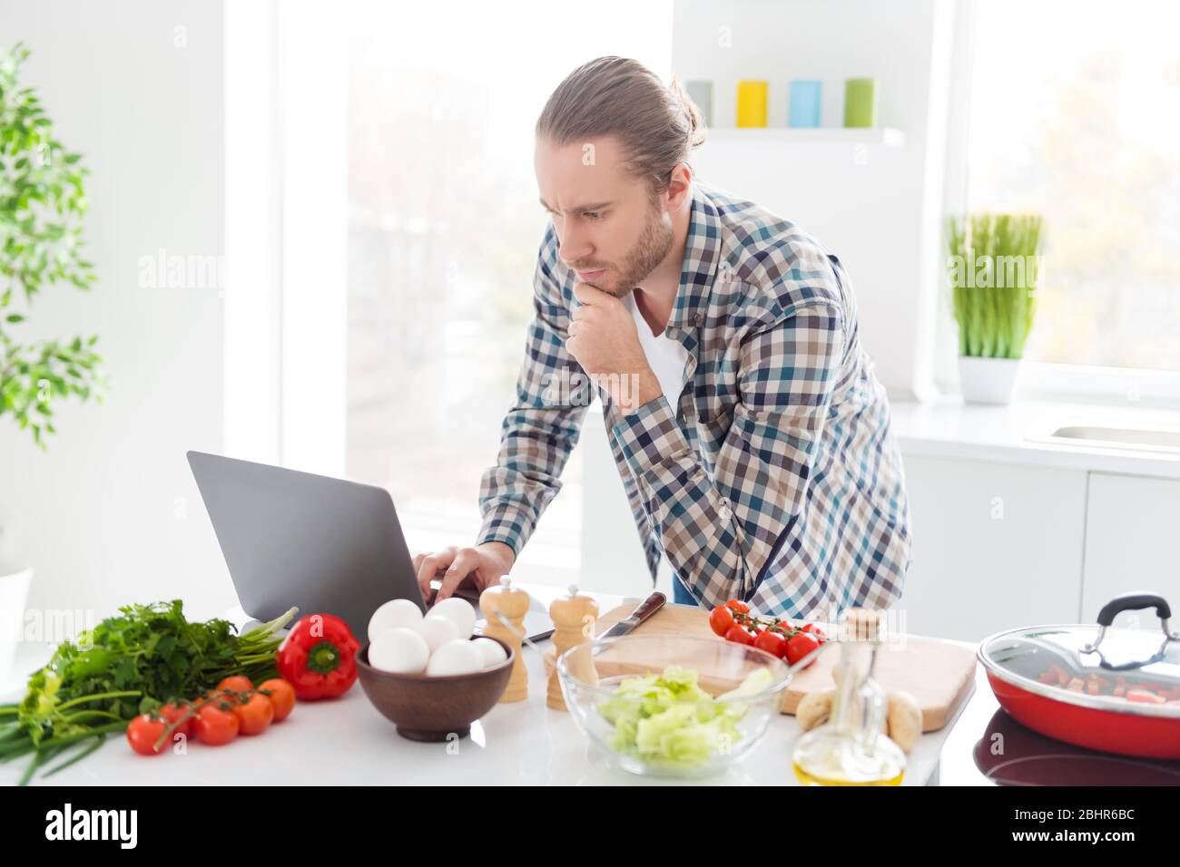 How cook this dish. Pensive minded thoughtful man want prepare tasty ...