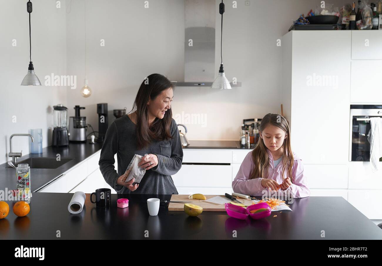 Girl in kitchen during cooking hi-res stock photography and images - Alamy
