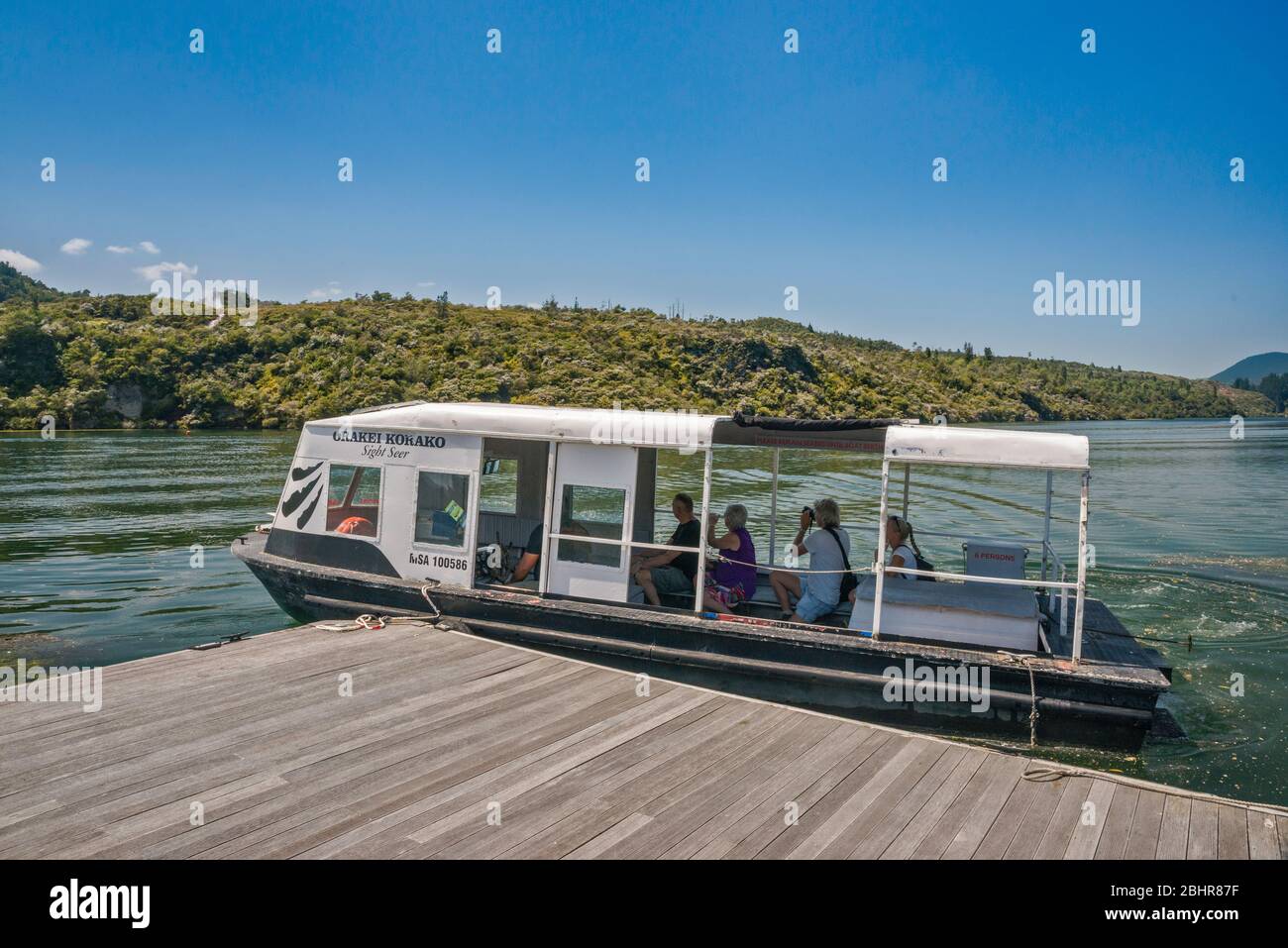 Boat carrying visitors across Lake Ohakuri to Orakei Korako Thermal ...