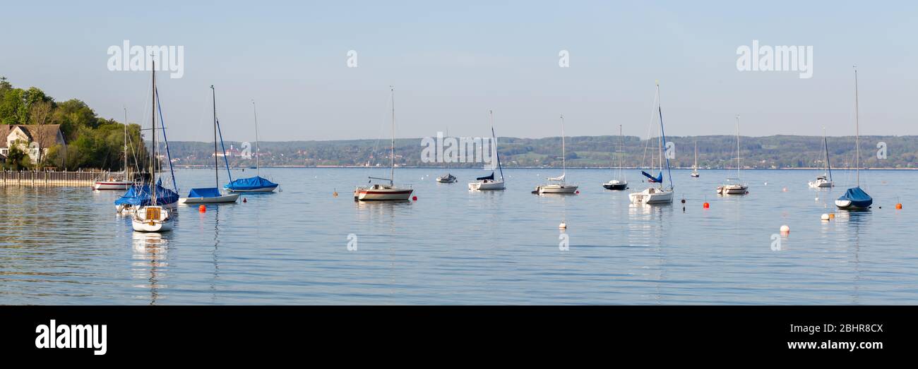 Panorama with sailboats anchoring at Ammersee (Lake Ammer). Sailing is ...