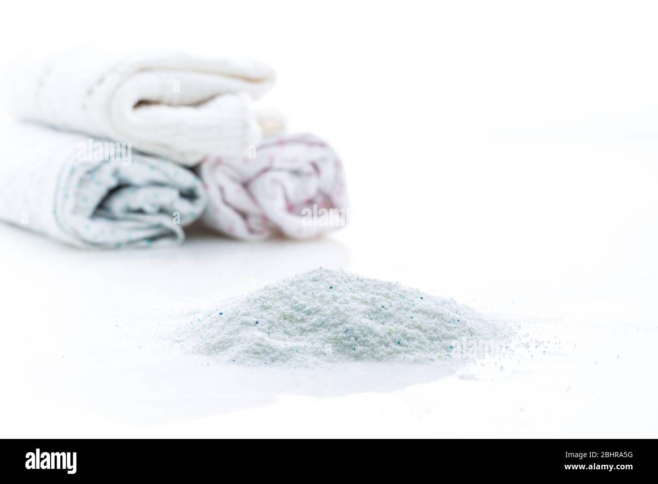 Laundry - Washing powder with clothes isolated on white background ...
