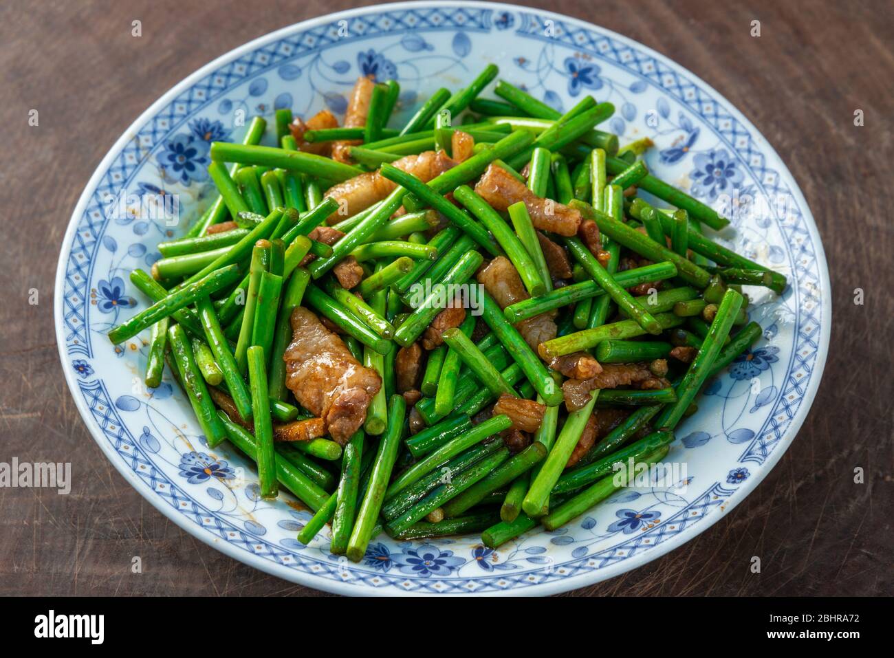 Stir-fried pork with garlic sprouts, Chinese Food Stock Photo - Alamy