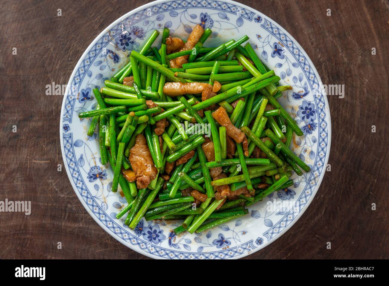 Stir-fried pork with garlic sprouts, Chinese Food Stock Photo - Alamy