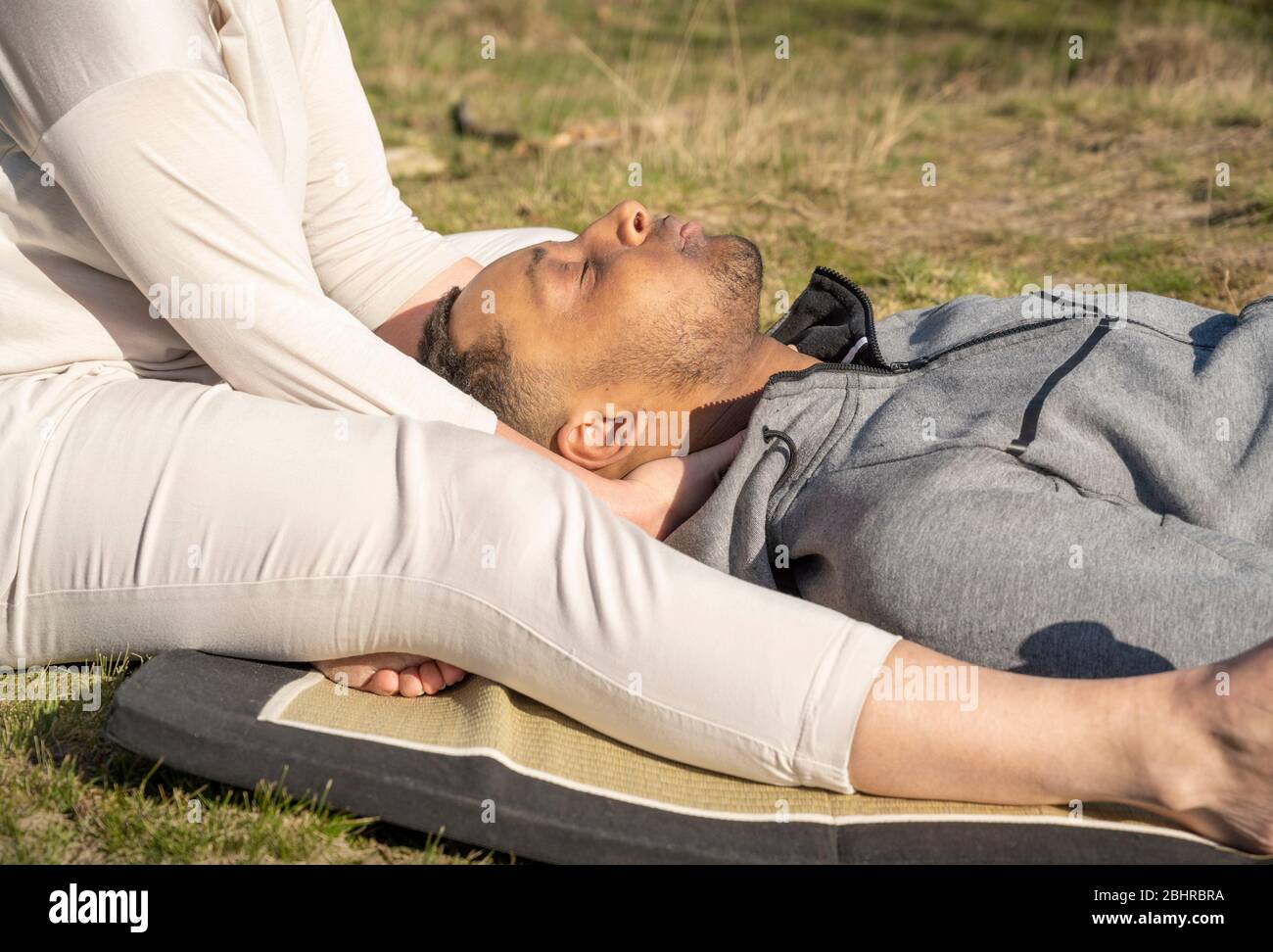 Man sitting on a mat hi-res stock photography and images - Alamy