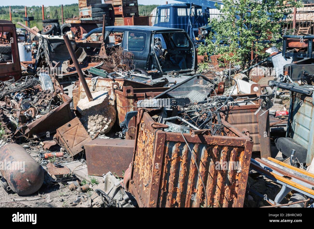 Pile of rusty metal garbage on junkyard, global environment background ...