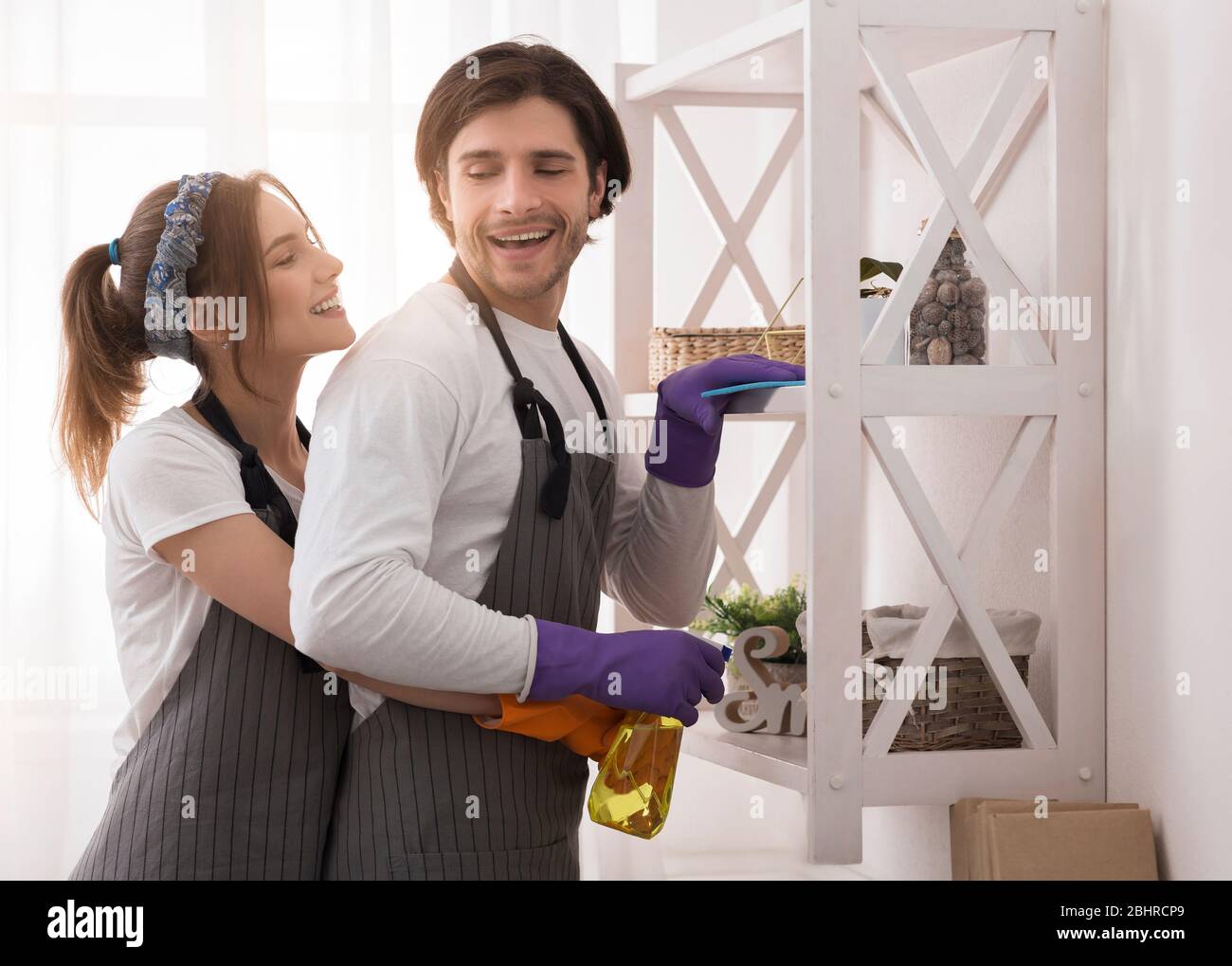 Young Romantic Couple Doing Housework At Home Together, Hugging And ...