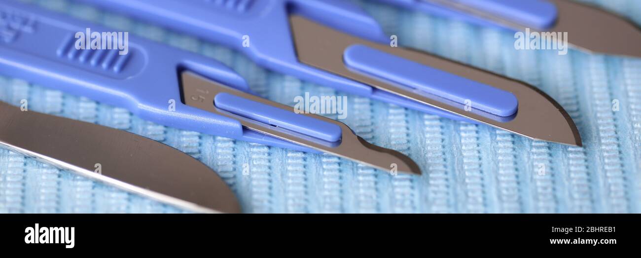 Close-up on table are medical tools scalpels Stock Photo - Alamy