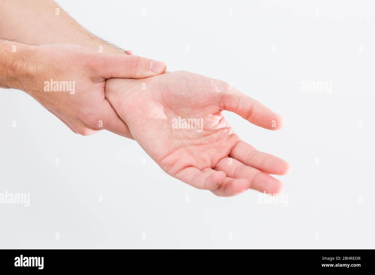 man's wrist hurts. A damaged female hand hurts. Hands suffer from work ...