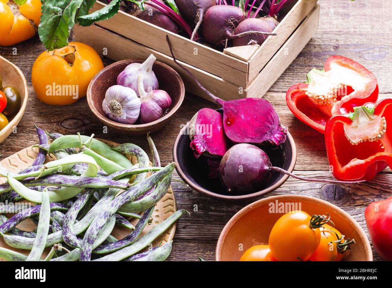 Fresh organic homegrown vegetables on rustic wooden table, sustainable ...