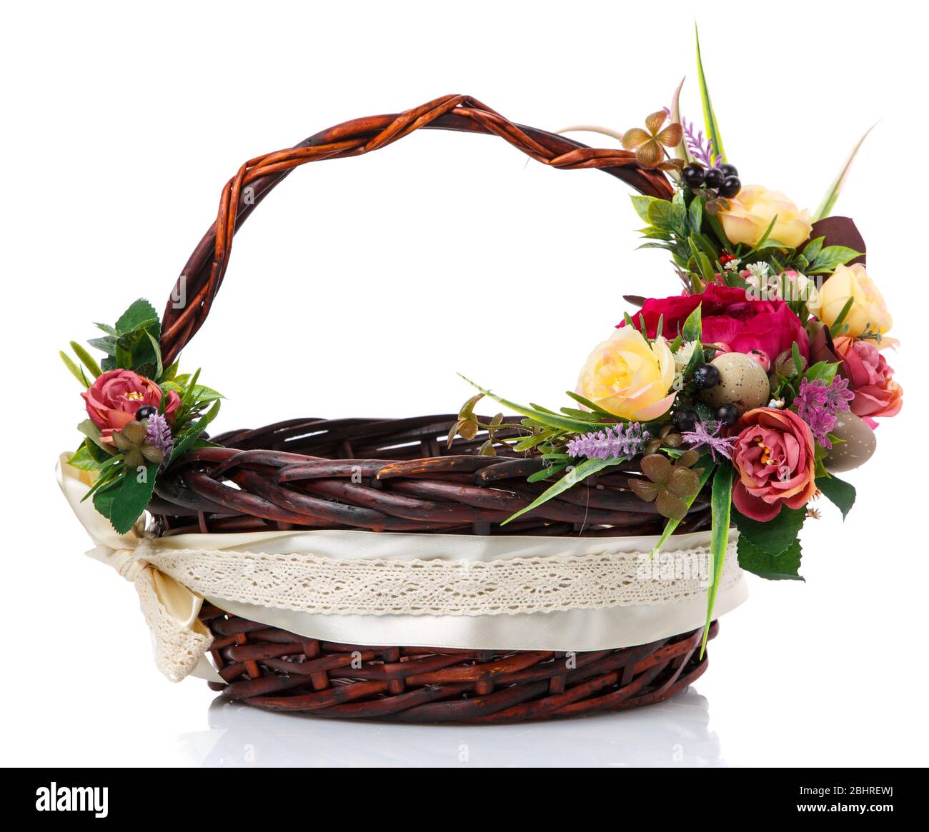 Wicker design baskets are decorated with a floral arrangement for ...