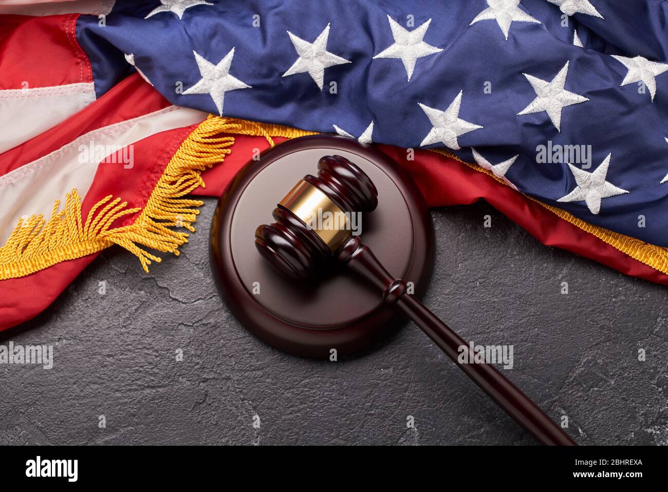 Top view of judge gavel against background of American flag on black ...