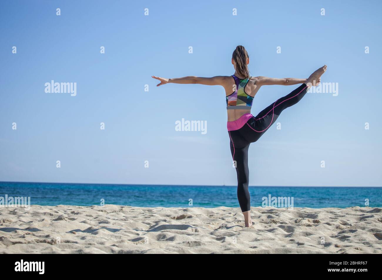 Woman doing yoga sandy hi-res stock photography and images - Alamy