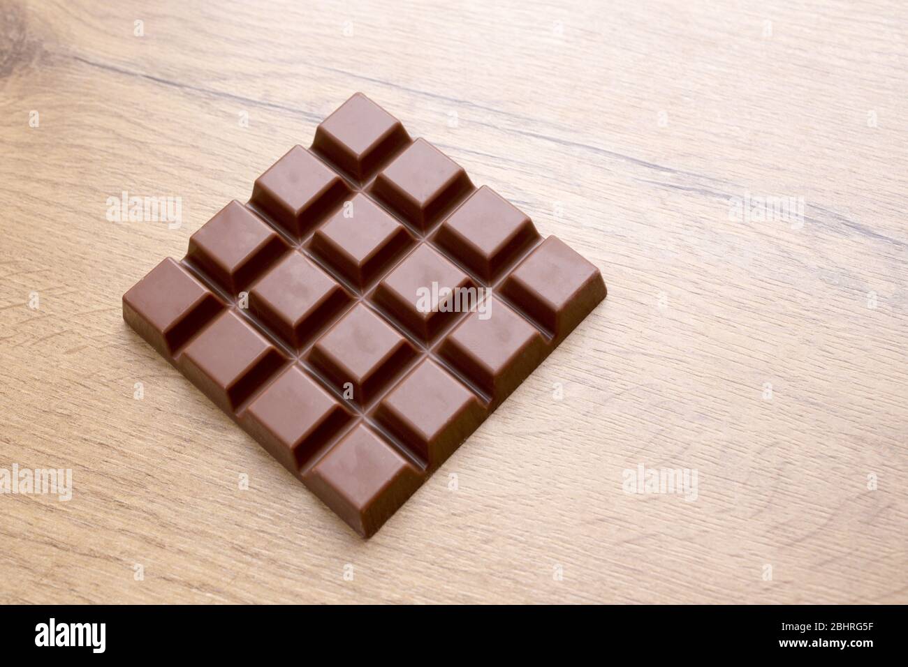 detail of delicious chocolate bar on wooden table Stock Photo - Alamy