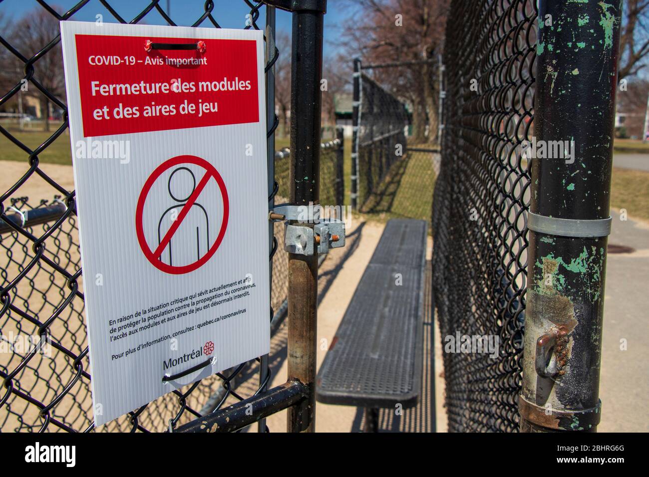 Closed sign on baseball field fence and public park during coronavirus ...