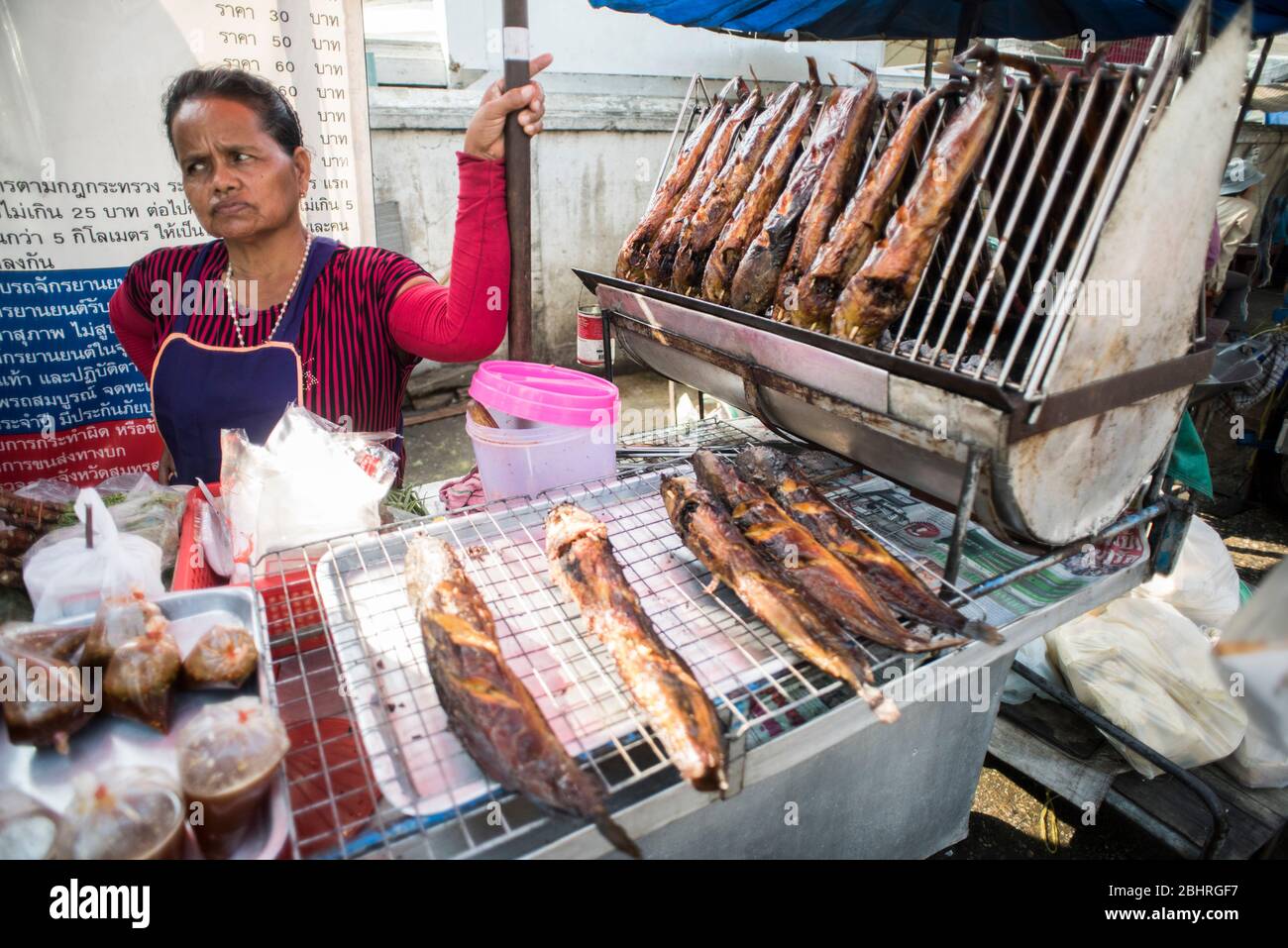 Women selling grilled fish hi-res stock photography and images - Alamy