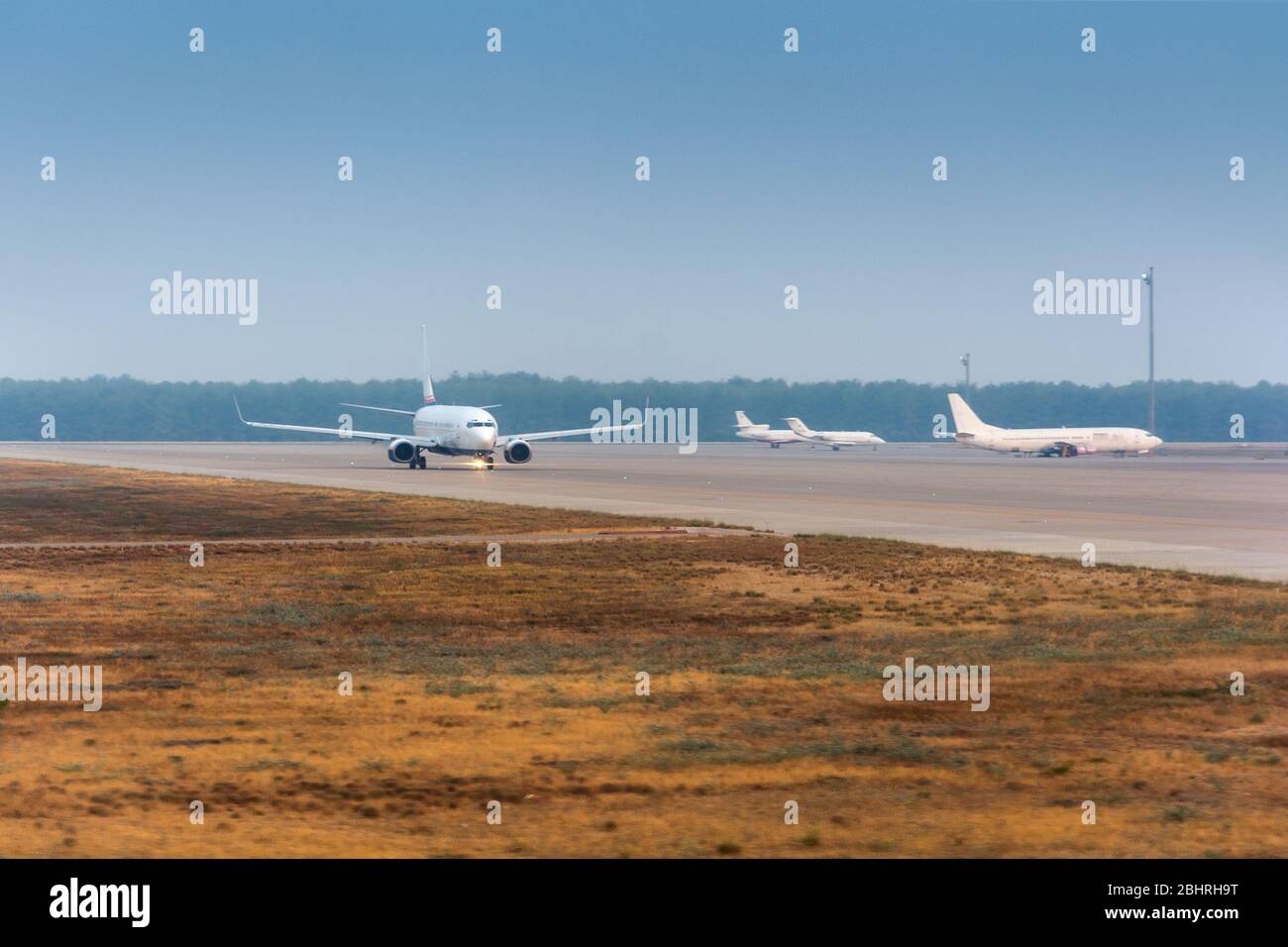 Plane waiting for take off from airport on sunrise. Vacation concept ...