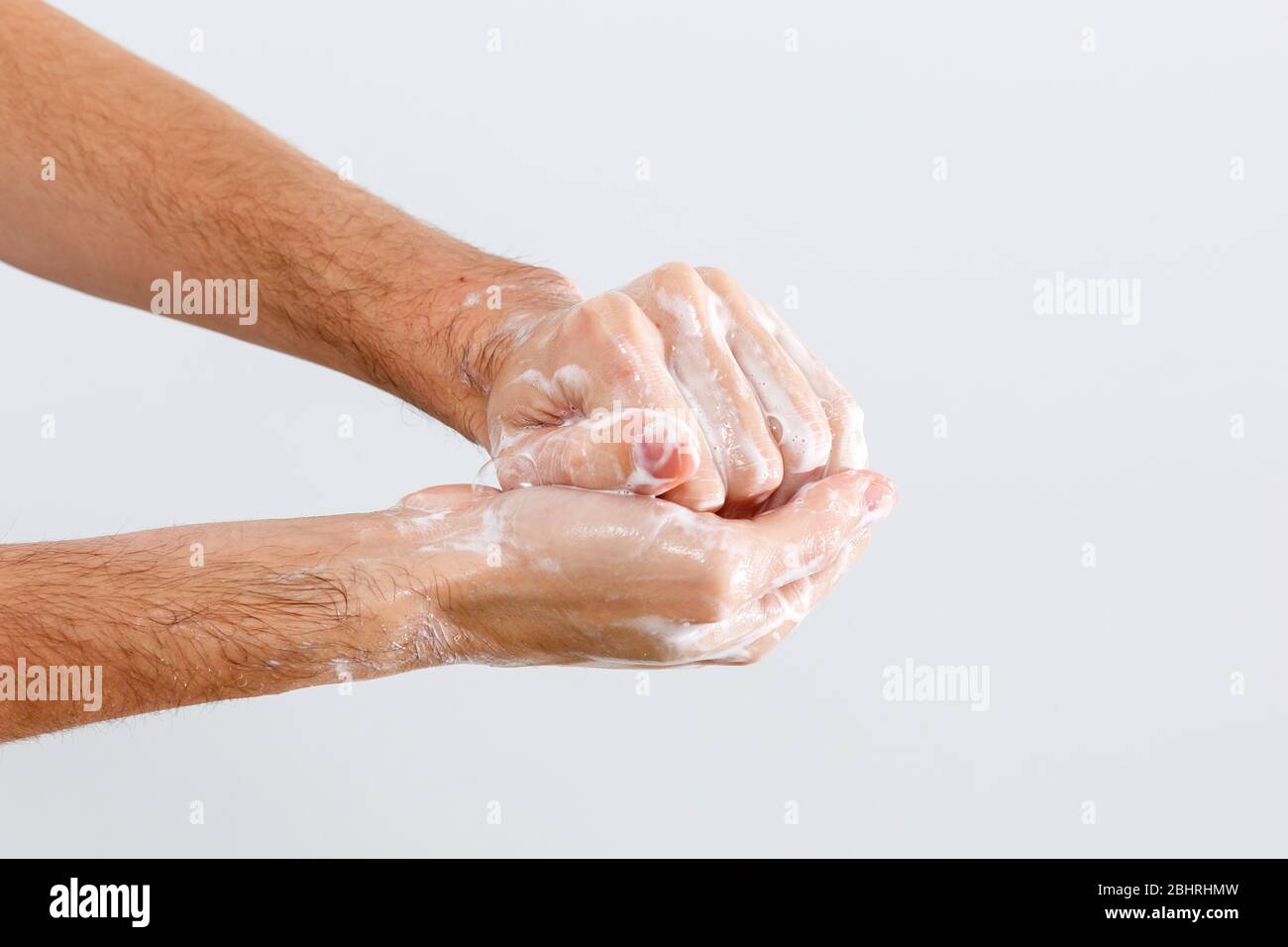Close up image of washing hand against white background Stock Photo - Alamy