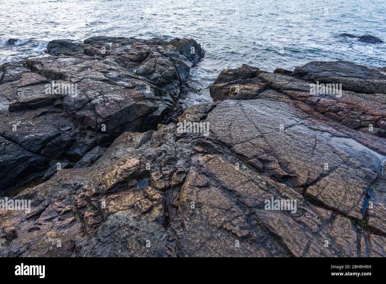 Landscape of horizontal rock formations and water Stock Photo - Alamy