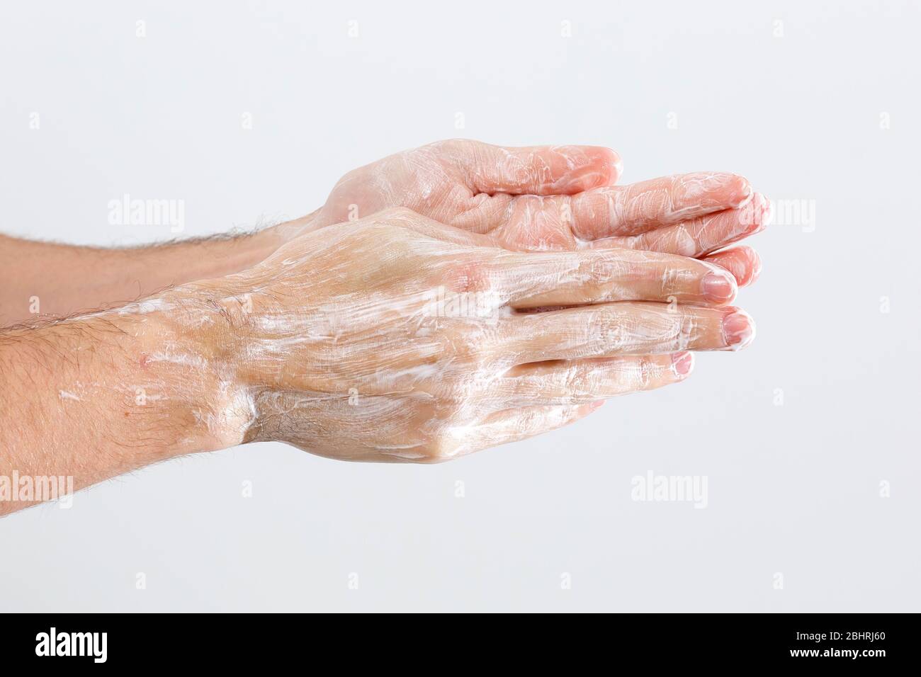Close up image of washing hand against white background Stock Photo - Alamy
