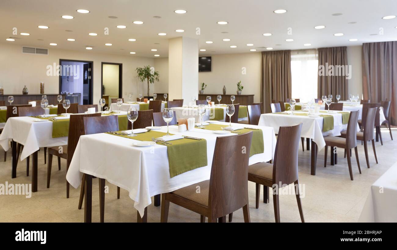Restaurant interior in hotel. Brown and green design Stock Photo - Alamy