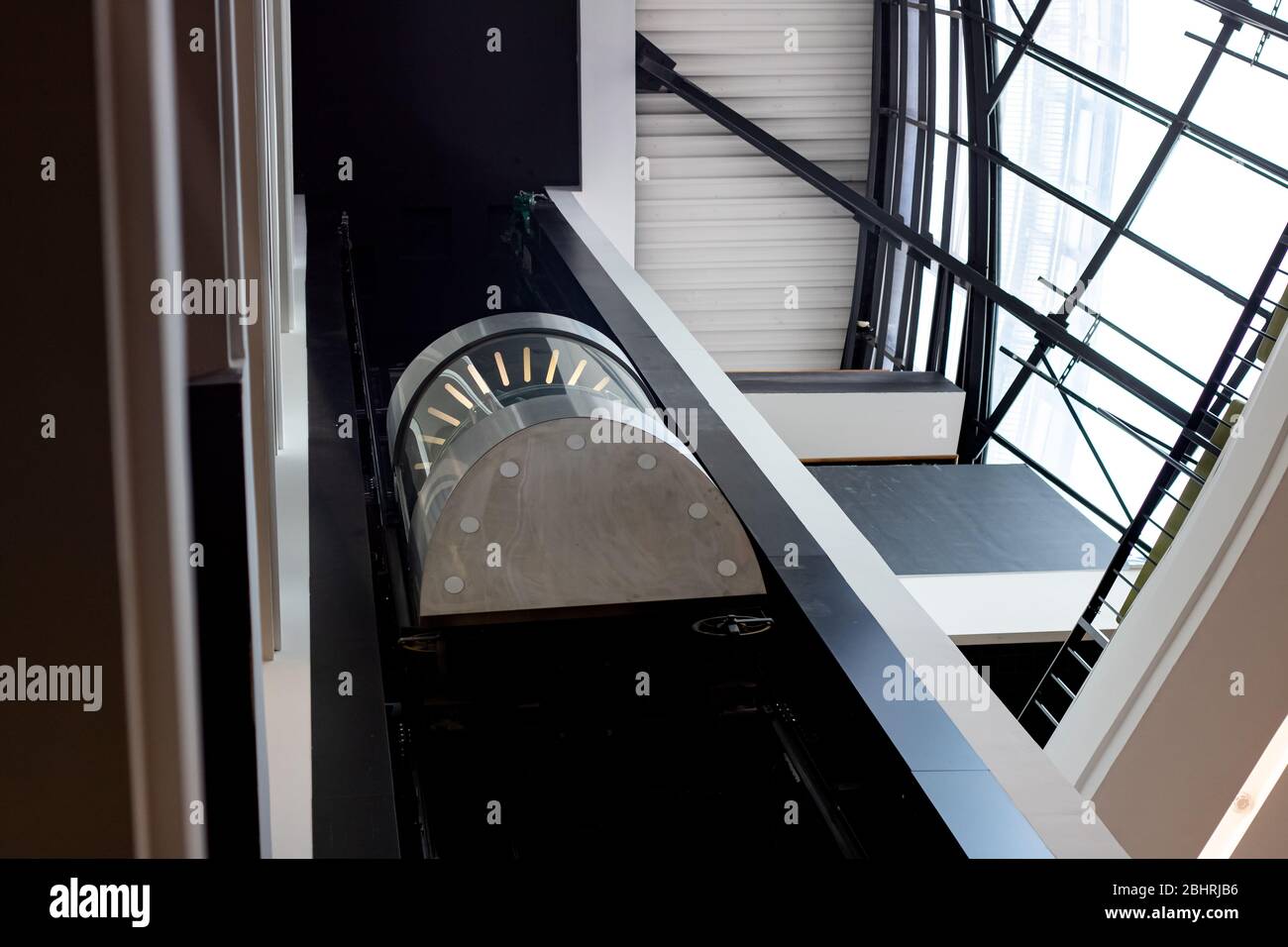 Glass elevator in a modern building close up Stock Photo - Alamy