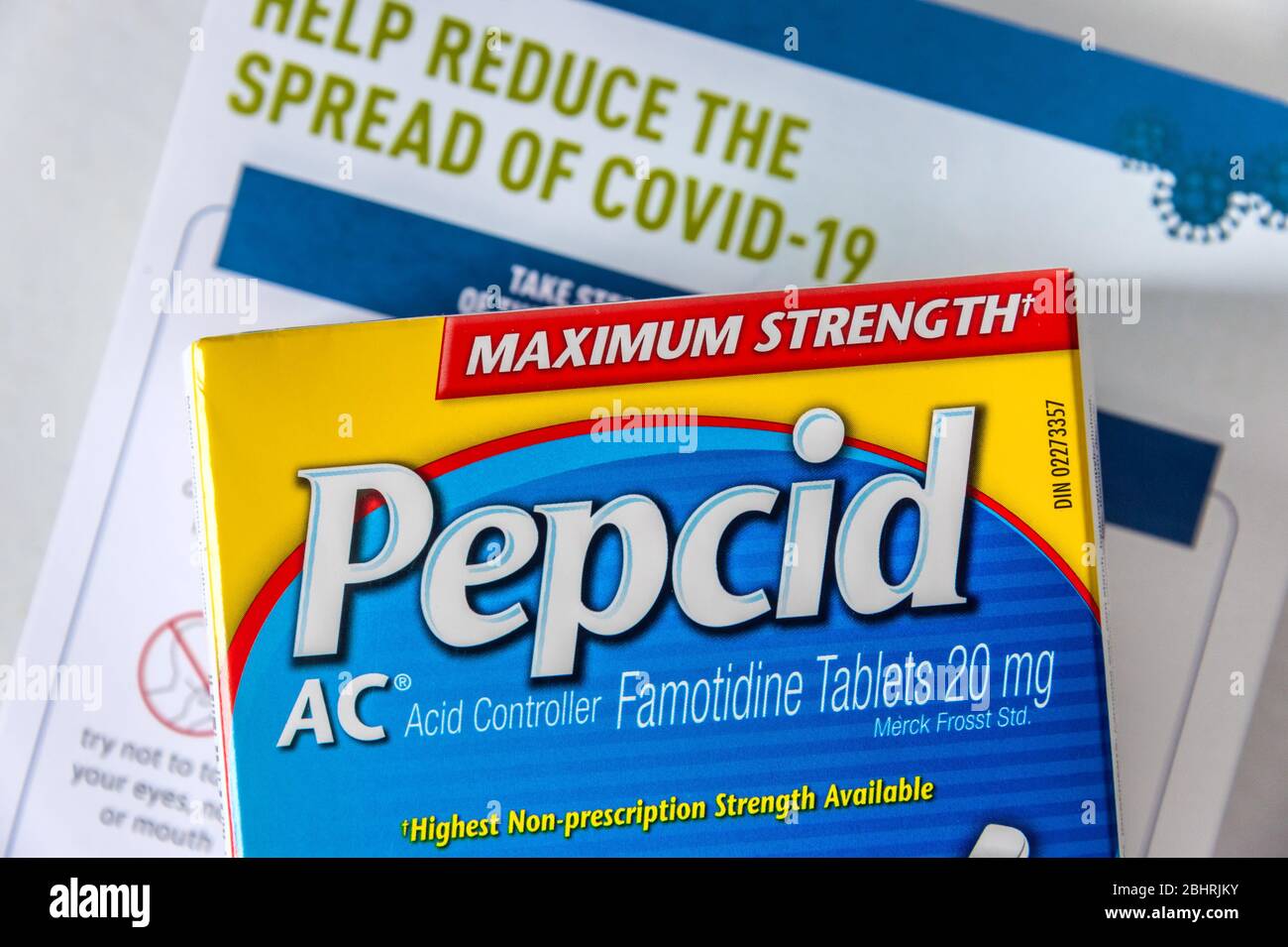 Box of Pepcid AC antacid medicine in front of a Covid-19 prevention ...