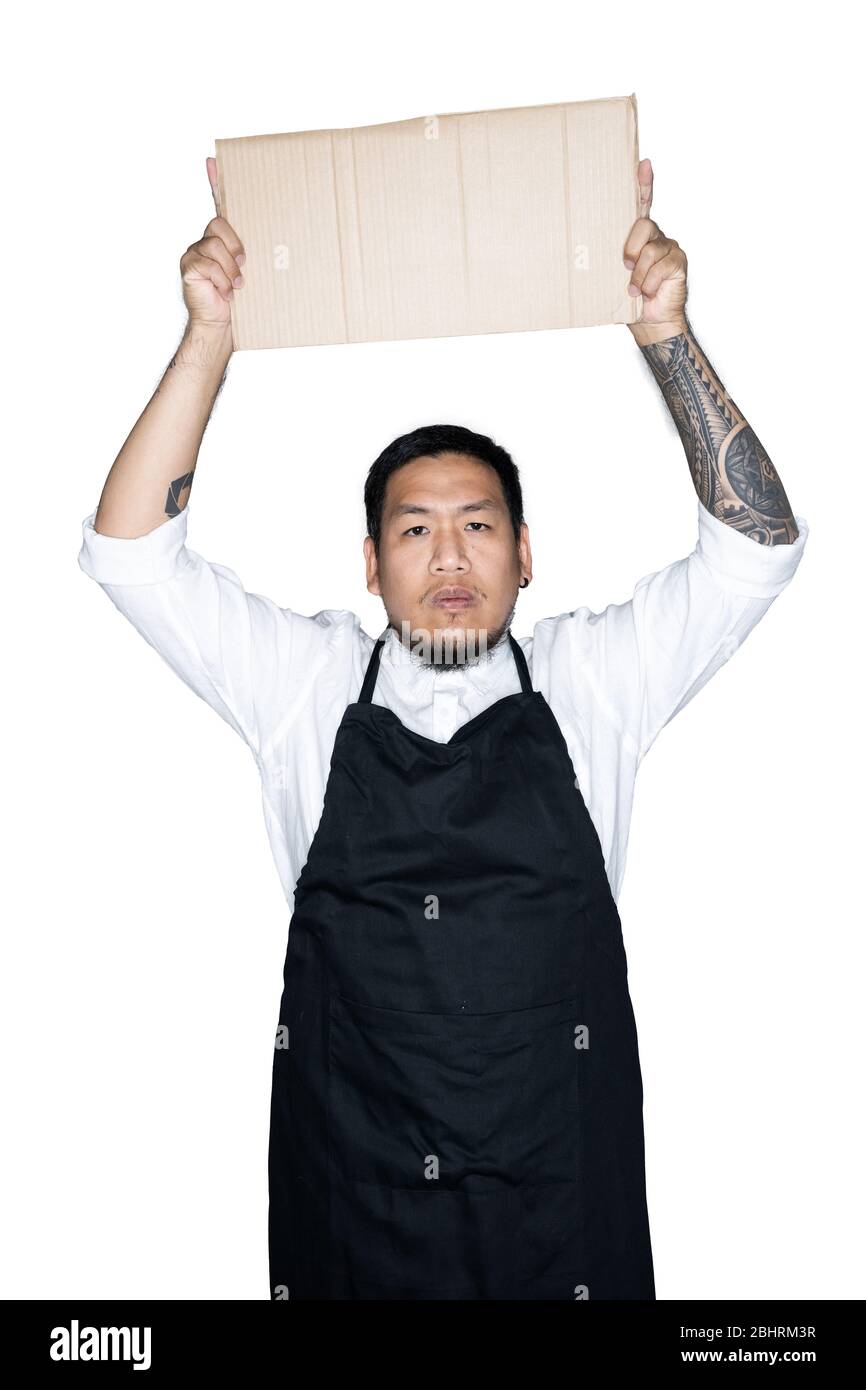 Bearded asian men waiter, chef dressed in black apron is holding ...