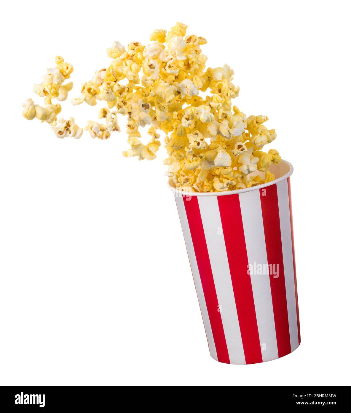 Flying popcorn from paper striped bucket isolated on black background ...