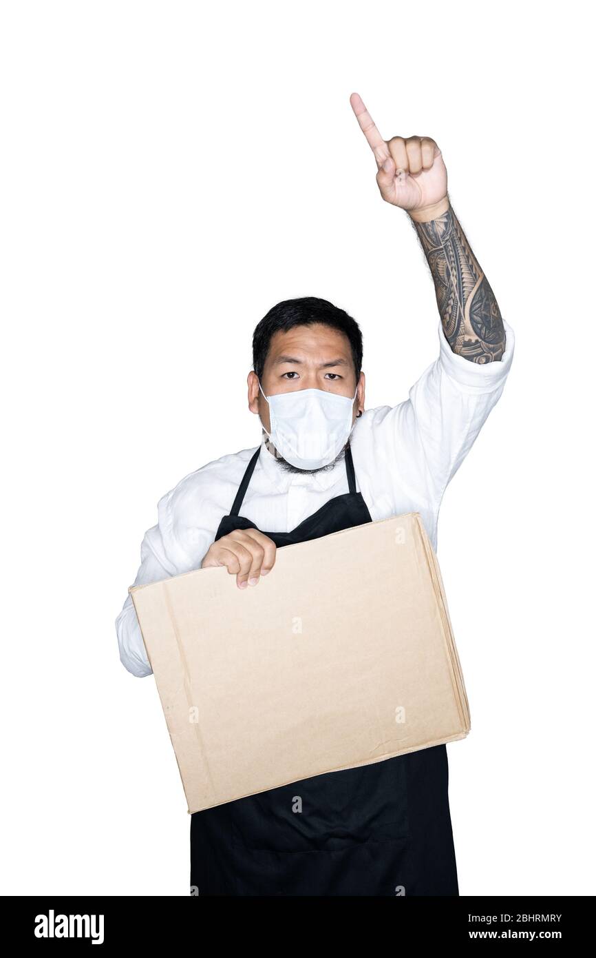 Bearded asian men waiter, chef dressed in black apron with medical mask ...