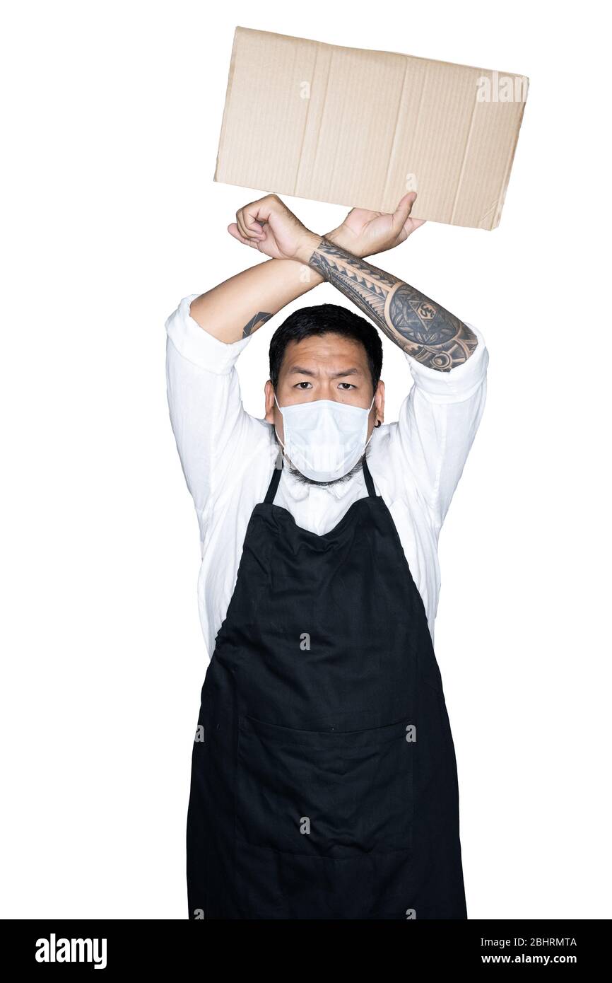 Bearded asian men waiter, chef dressed in black apron with medical mask ...