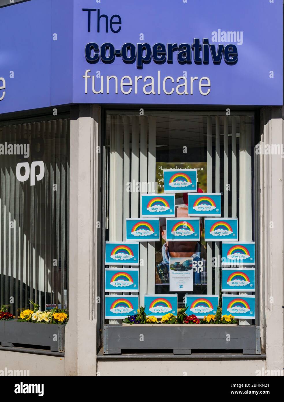 The Cooperative Funeral home shop window with stay safe rainbow ...