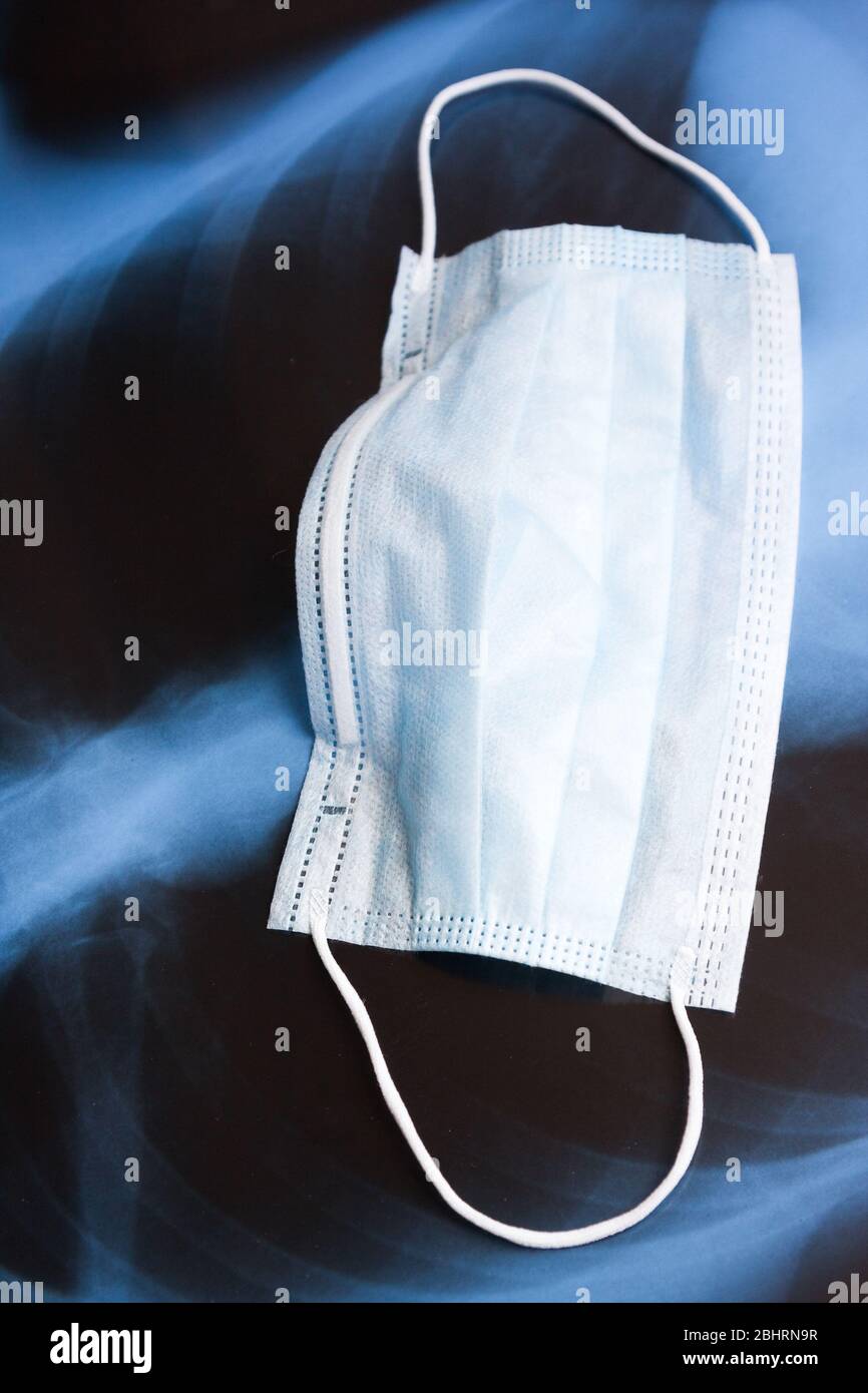 Blue respiratory mask on x-ray of human lungs, Close up. Coronavirus ...