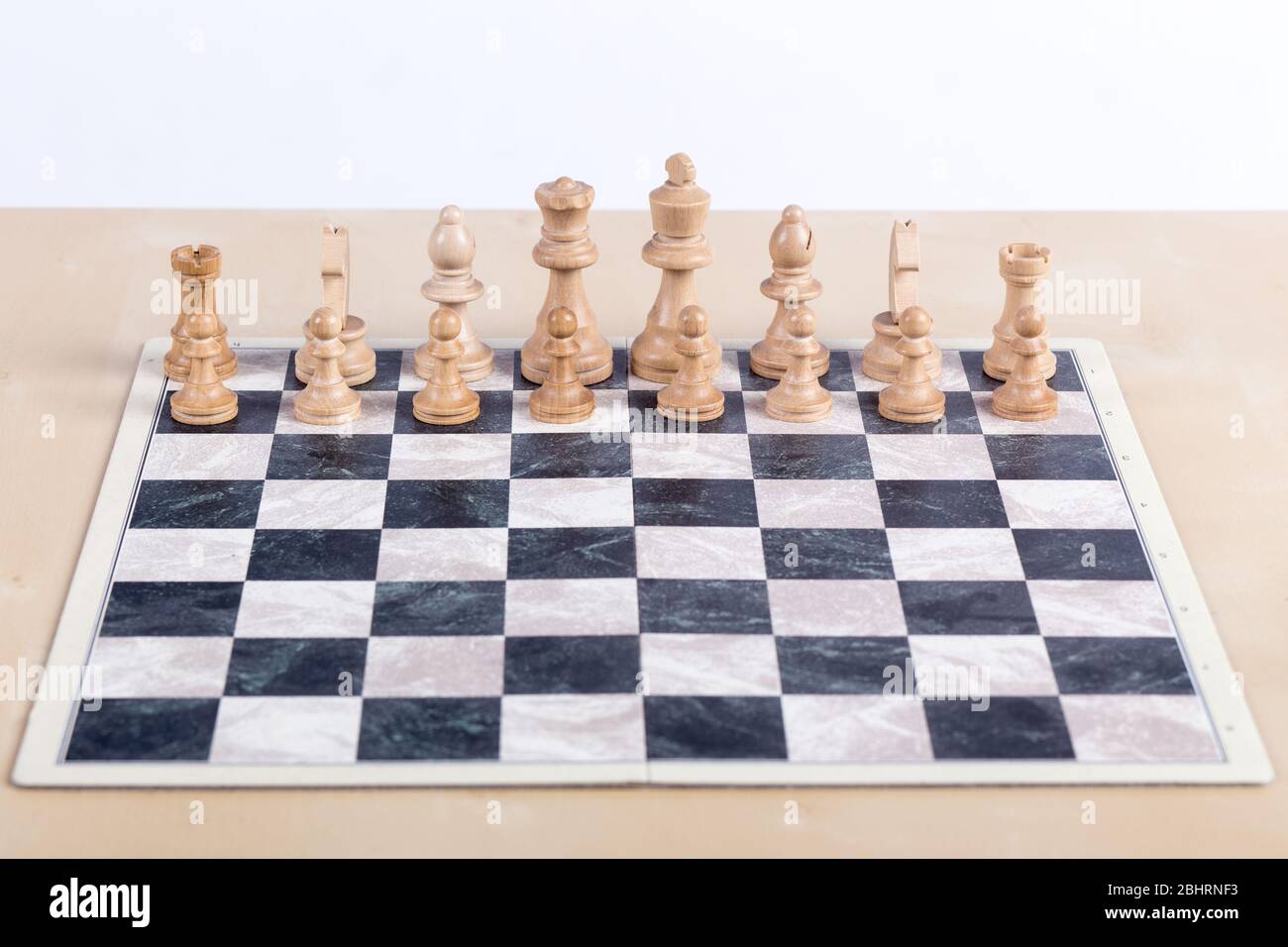 Close up of chess board with all the white pieces at start position ...