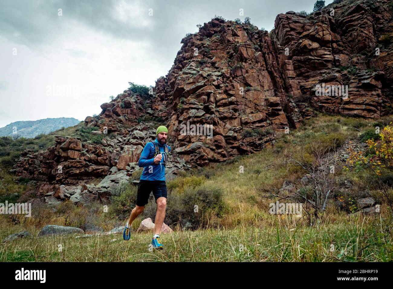 Athlete jogging among rocks hi-res stock photography and images - Alamy