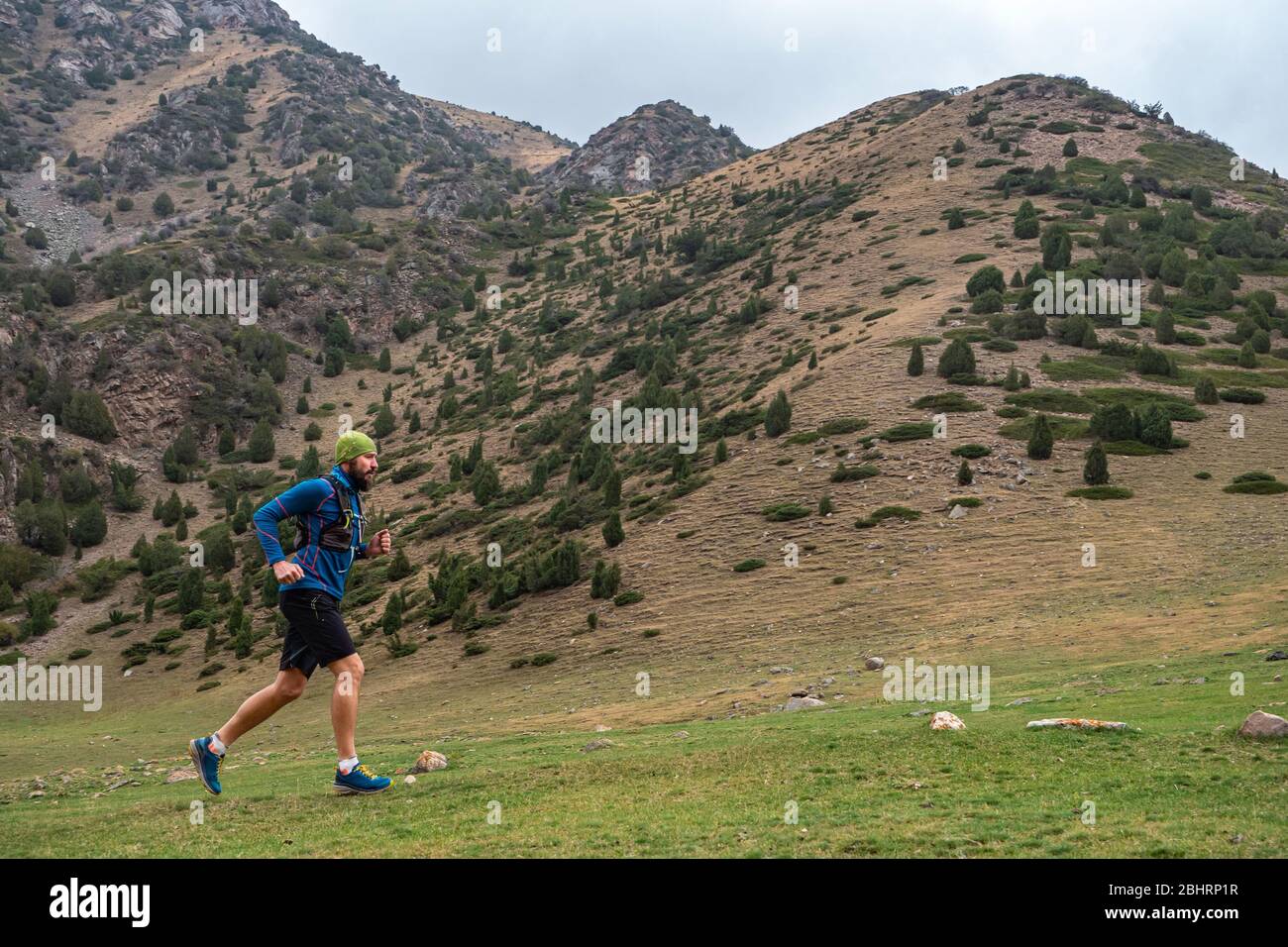 Athlete jogging among rocks hi-res stock photography and images - Alamy