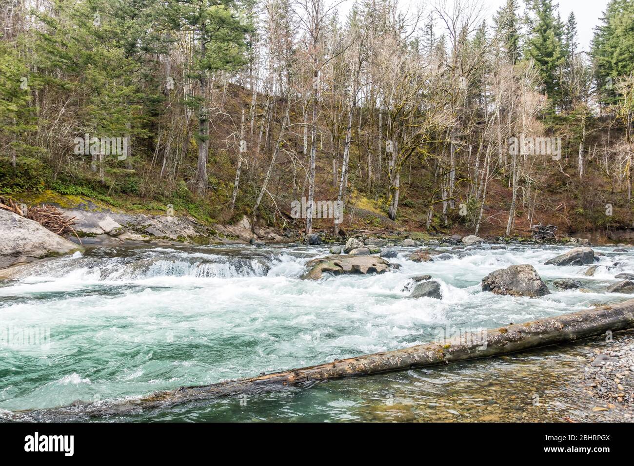Water flows over rocks to create whitewater in the Green River in ...