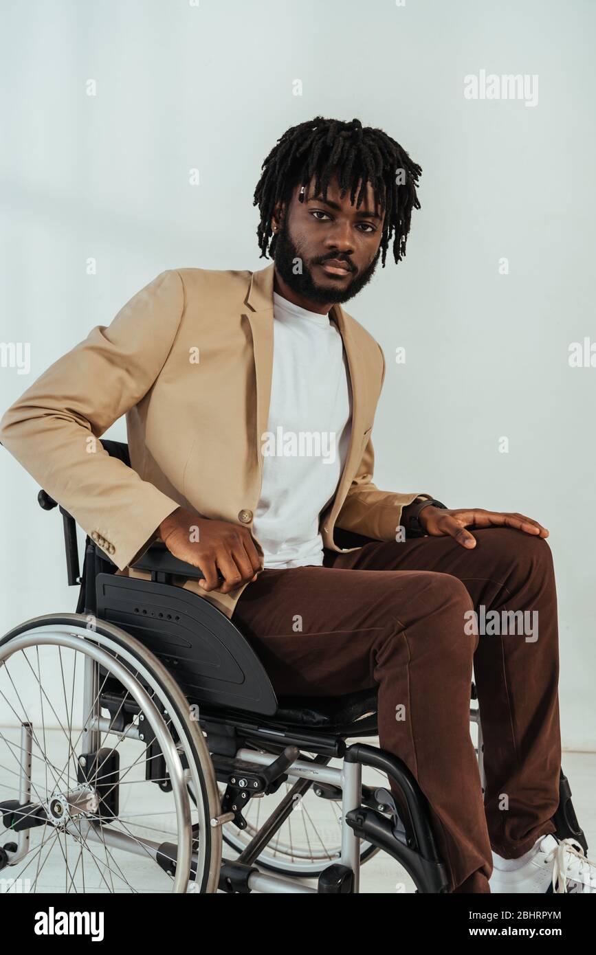 Disabled african american man on wheelchair on white Stock Photo - Alamy