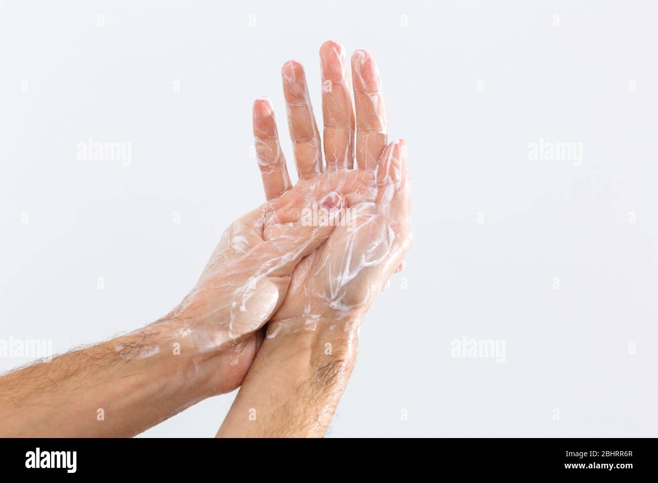 Close up image of washing hand against white background Stock Photo - Alamy