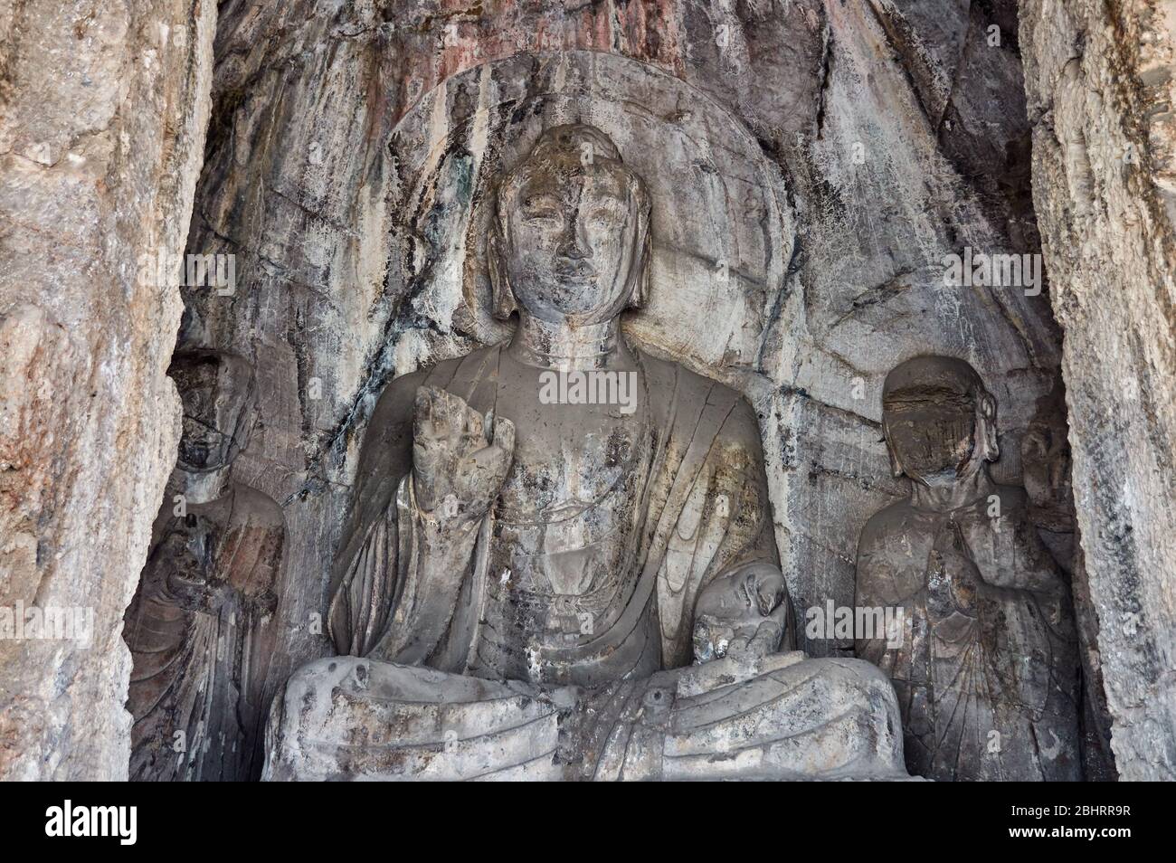 The Longmen Grottoes, Longmen Caves with statues of Buddha and his ...