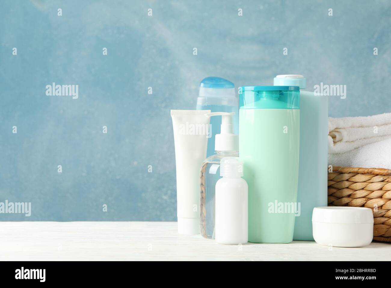 Body care products on blue background. Personal hygiene Stock Photo - Alamy