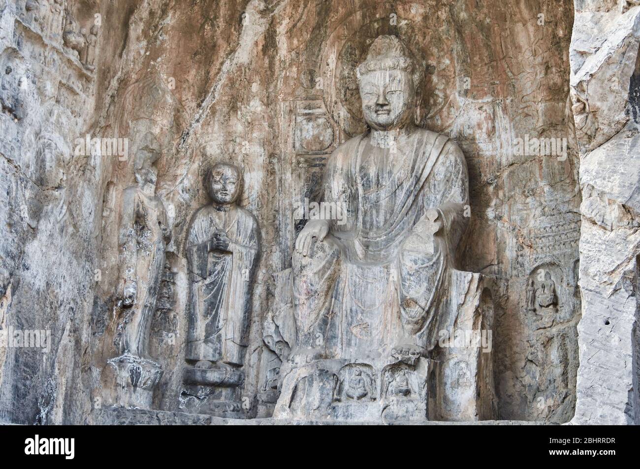 The Longmen Grottoes, Longmen Caves with statues of Buddha and his ...