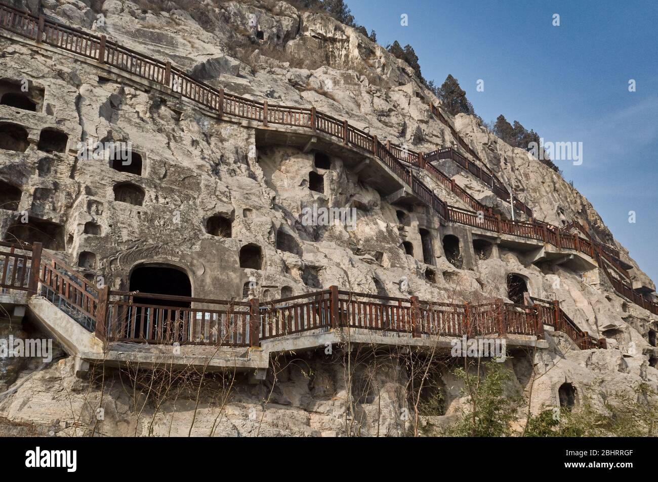 The Longmen Grottoes, Longmen Caves with statues of Buddha and his ...