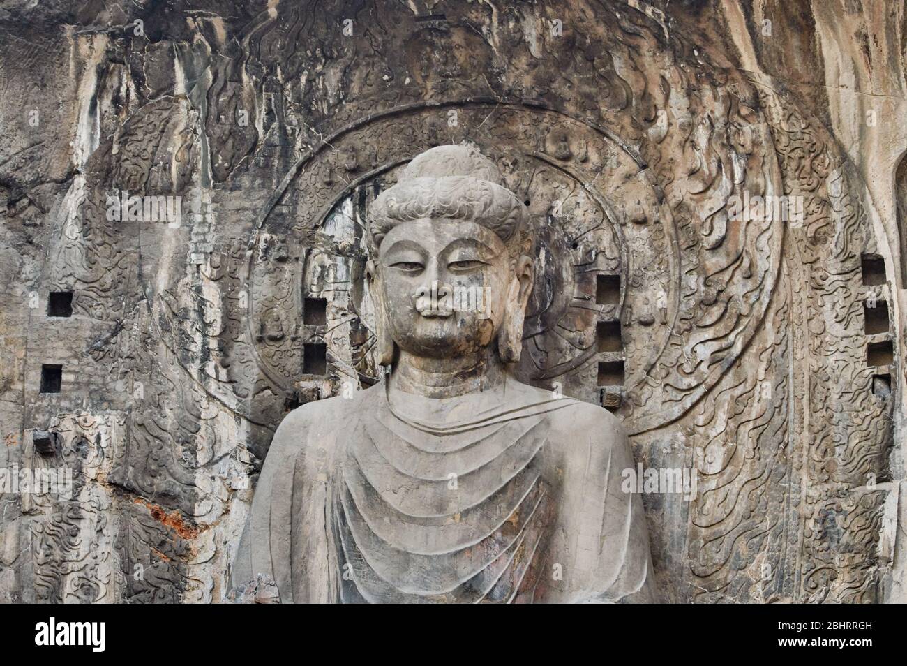 The Longmen Grottoes, Longmen Caves with statues of Buddha and his ...