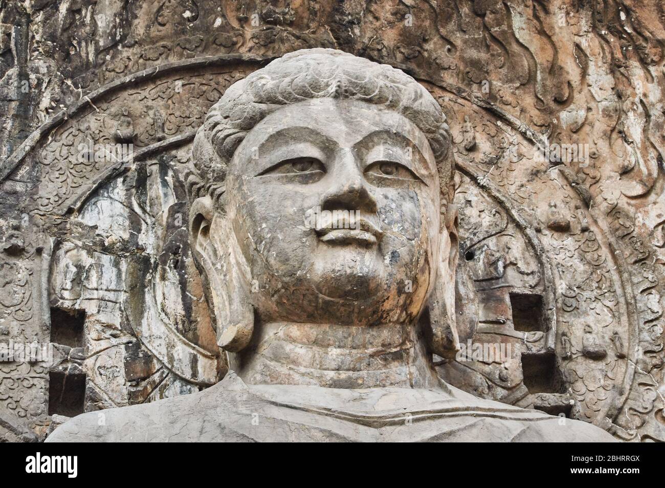 The Longmen Grottoes, Longmen Caves with statues of Buddha and his ...