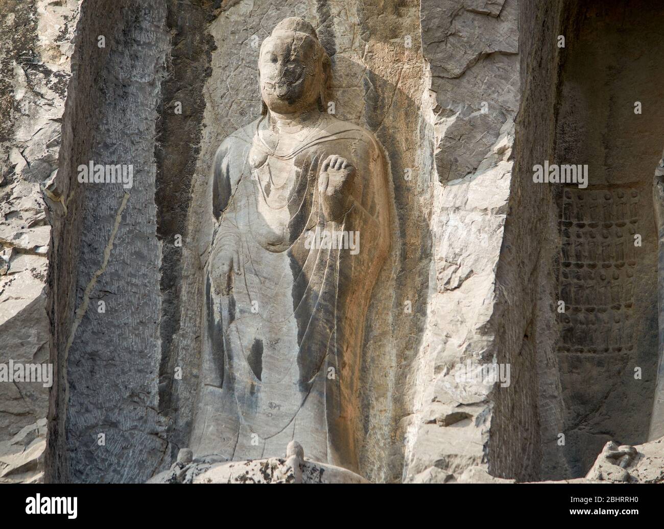 The Longmen Grottoes, Longmen Caves with statues of Buddha and his ...