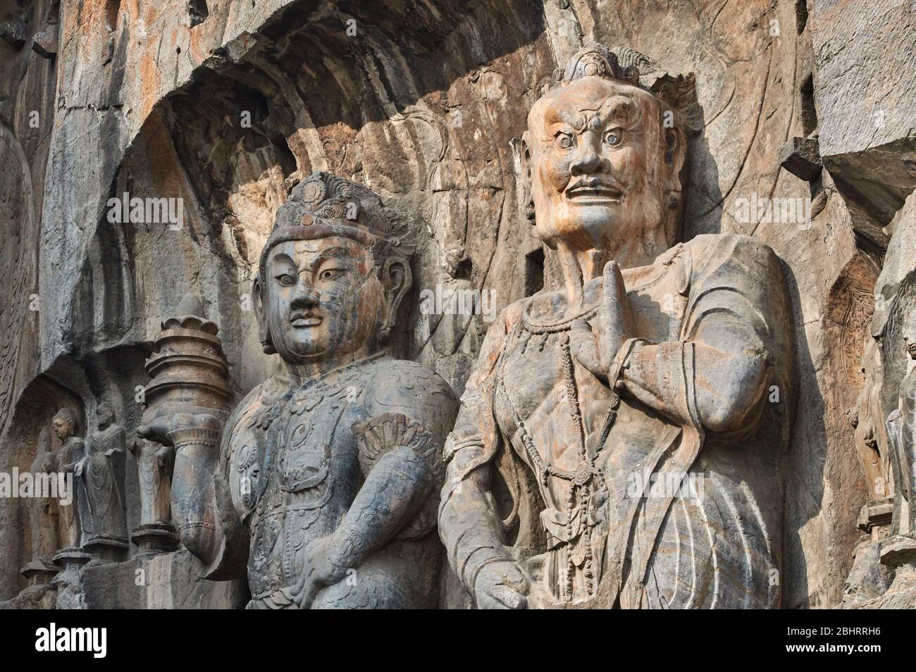 The Longmen Grottoes, Longmen Caves with statues of Buddha and his ...
