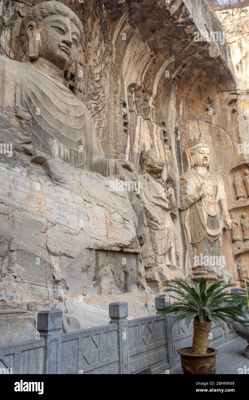 The Longmen Grottoes, Longmen Caves with statues of Buddha and his ...