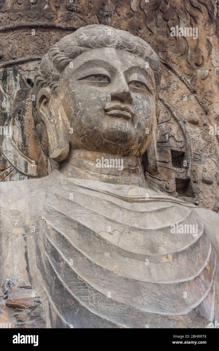 The Longmen Grottoes, Longmen Caves with statues of Buddha and his ...